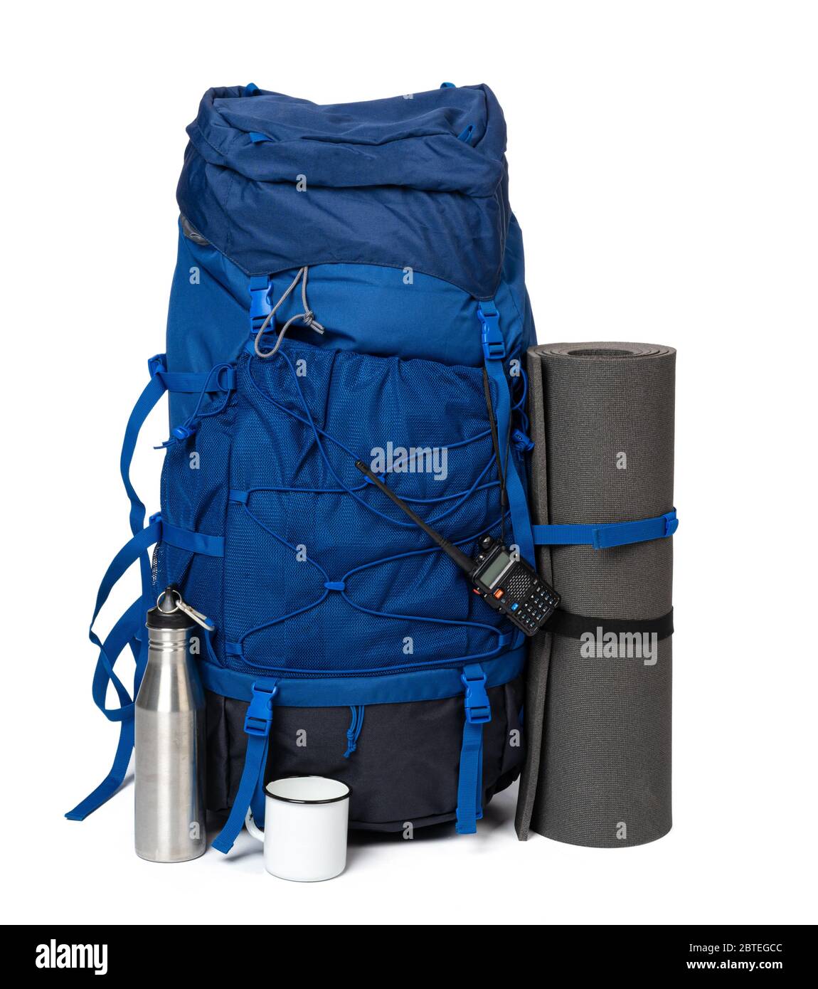 Blue hiking backpack with fitness mat isolated on white Stock Photo - Alamy