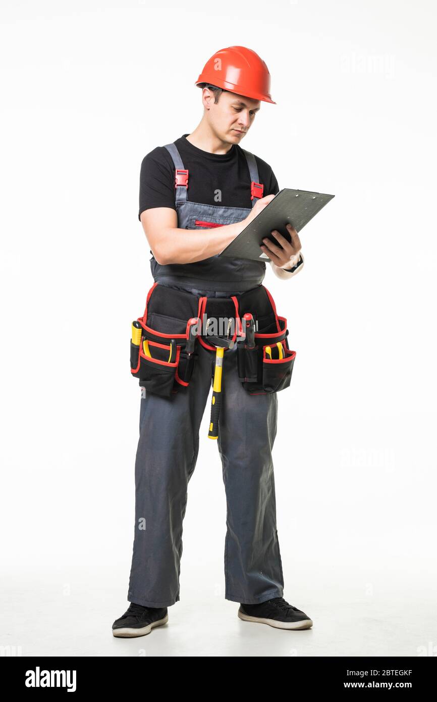 Full length portrait of a male builder over white wall background Stock ...