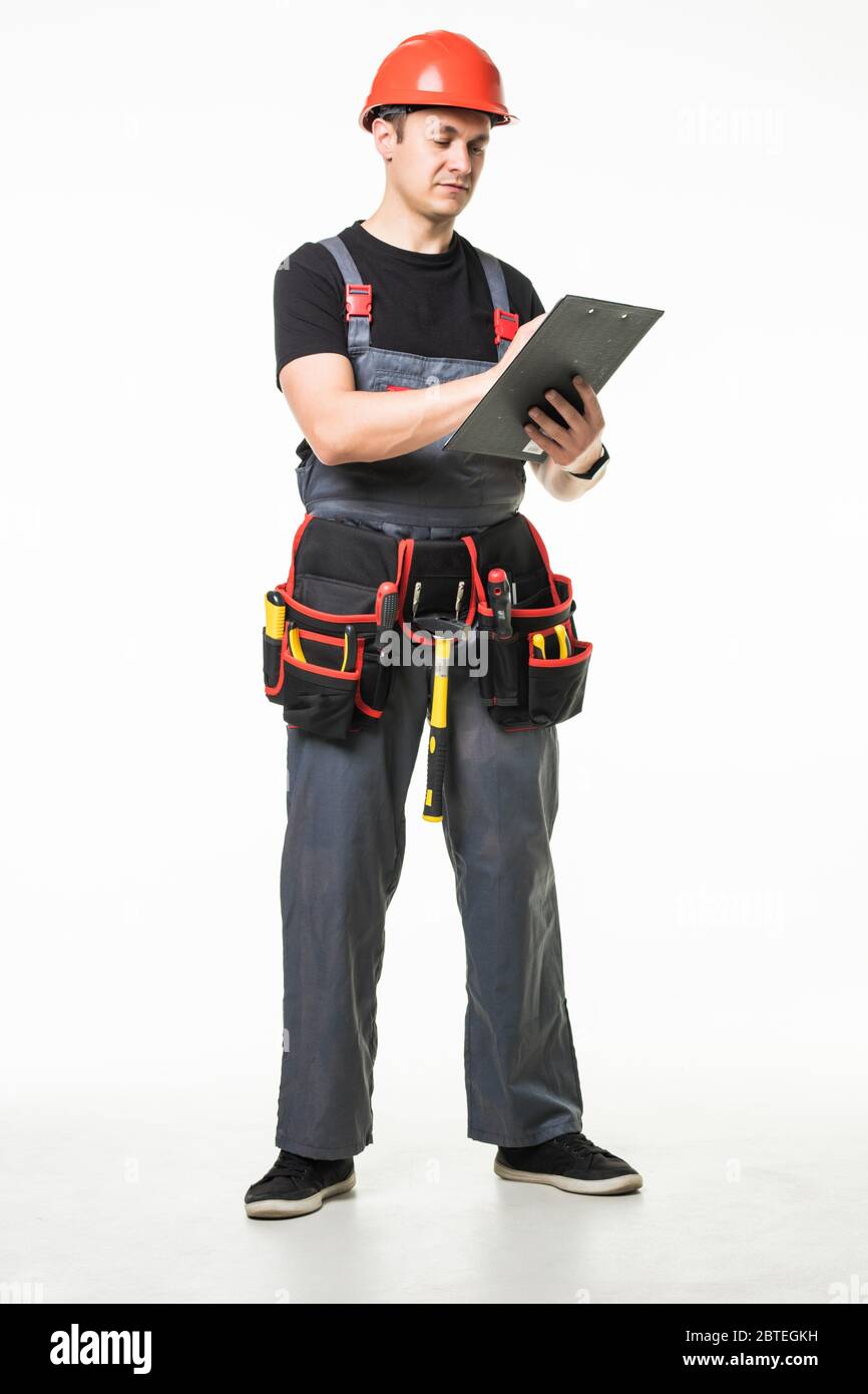Full length portrait of a male builder over white wall background Stock ...