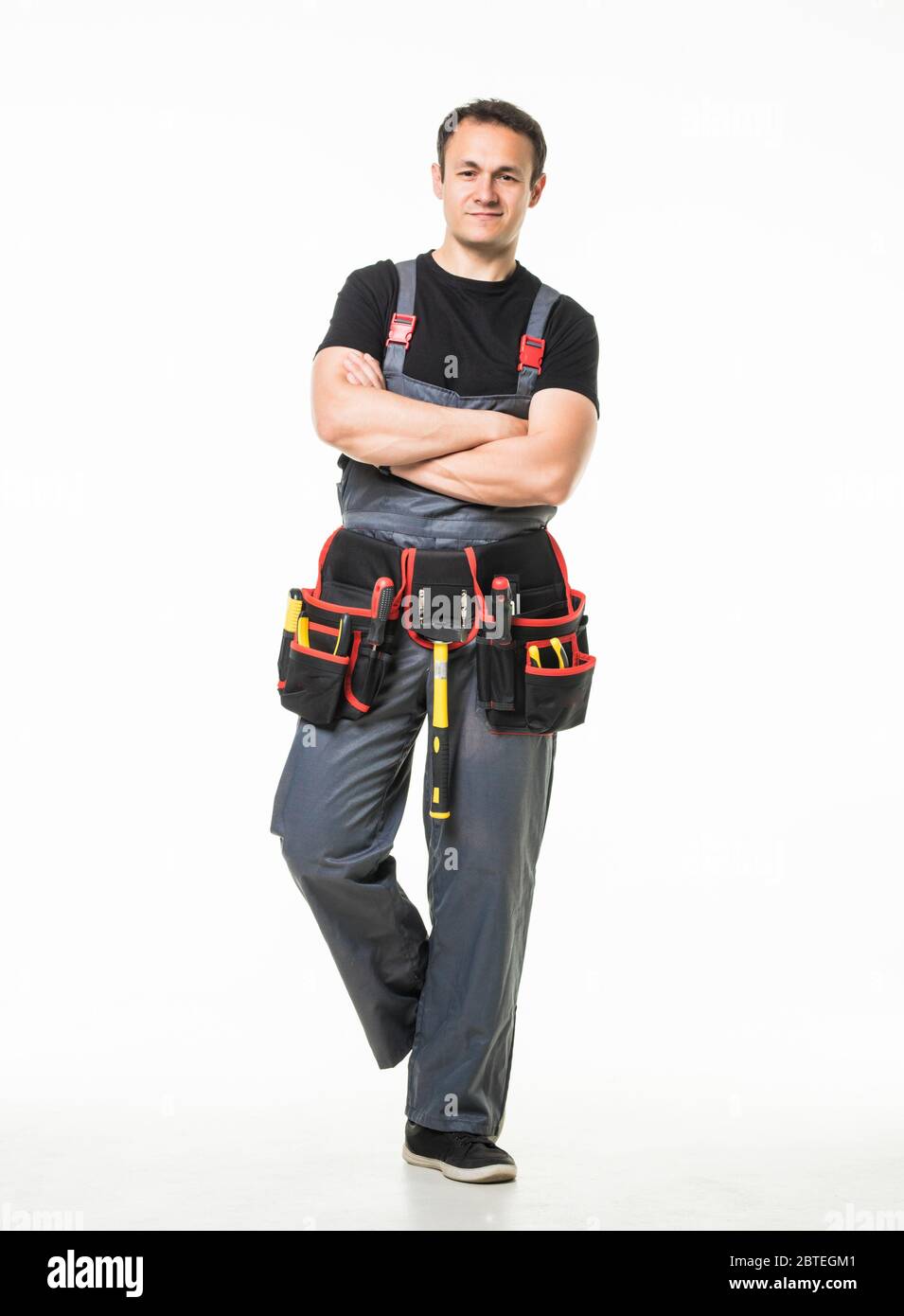 Portrait of handyman with tools showing isolated on white background ...