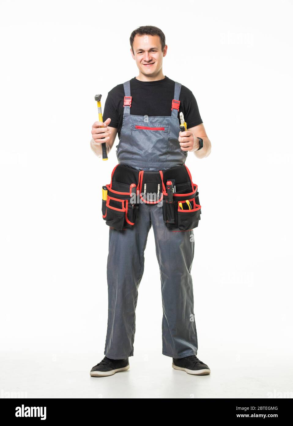 Worker with tools full portrait over white background Stock Photo - Alamy