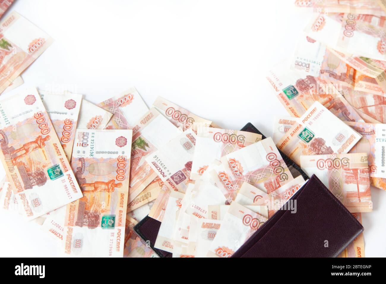 Russian money falls out of the purse. A pile of banknotes of five ...