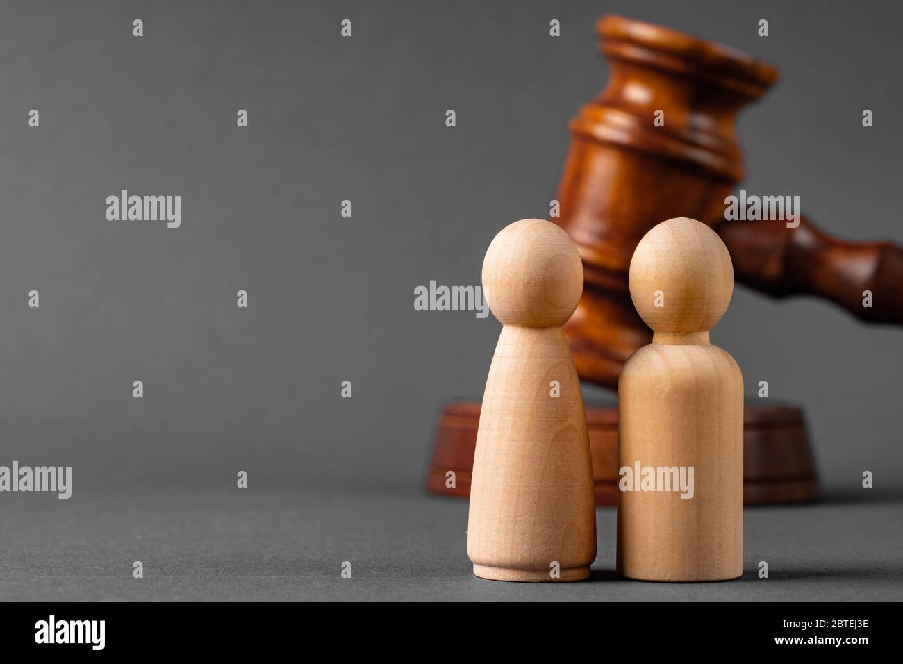 Wooden toy family and judge mallet. Family divorce concept Stock Photo ...