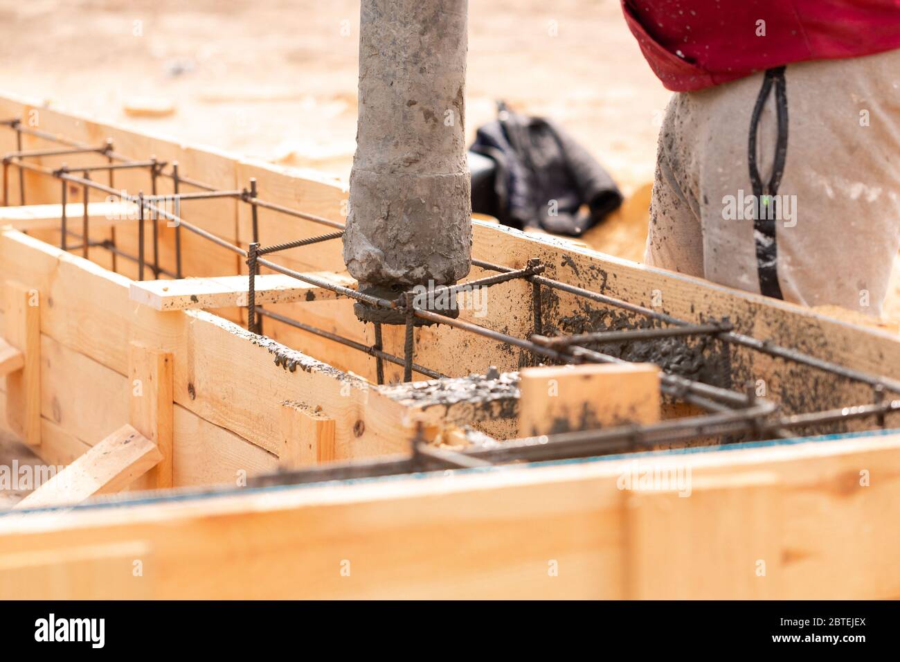 Close up of construction worker laying cement or concrete into the ...