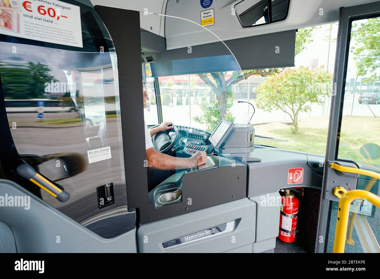 Sinsheim, Germany. 25th May, 2020. A bus driver sits in a bus of the ...