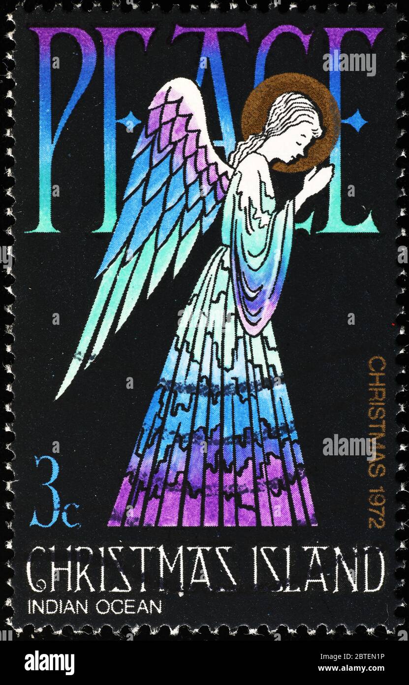 Angel wishing peace on postage stamp Stock Photo - Alamy