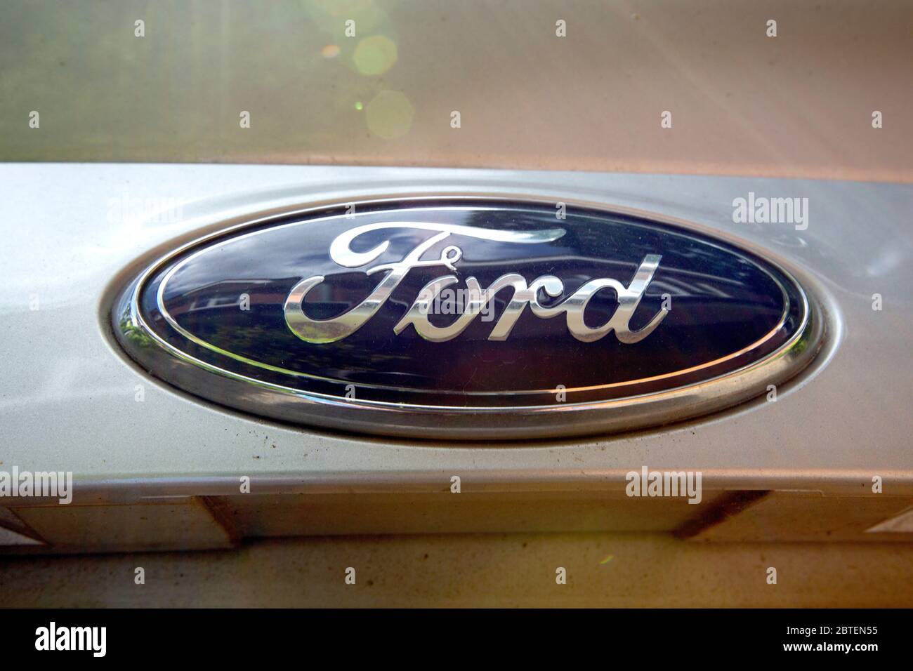 The famous logo badge of the Ford car company attached to a Kuga Stock ...