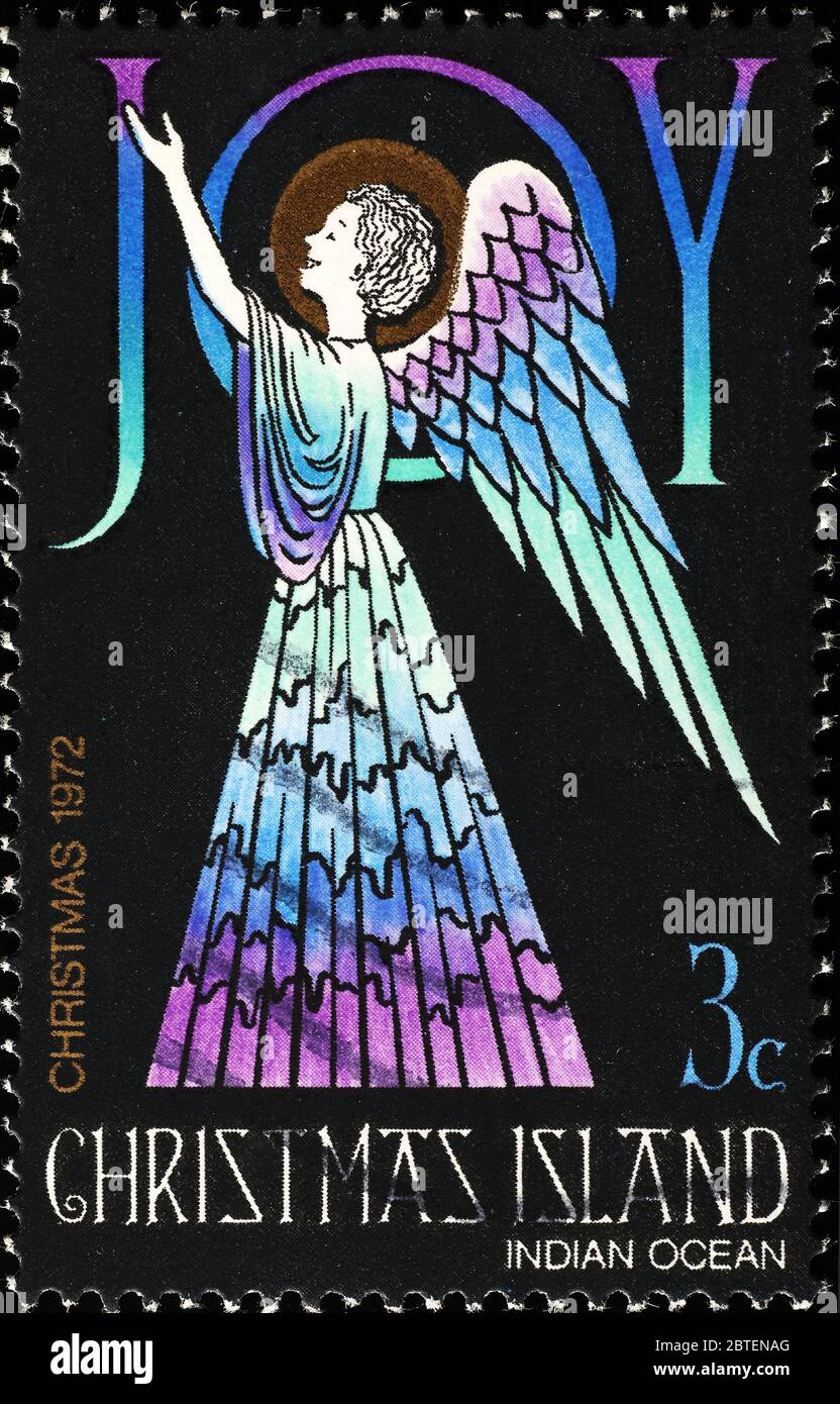 Angel wishing joy on postage stamp Stock Photo - Alamy