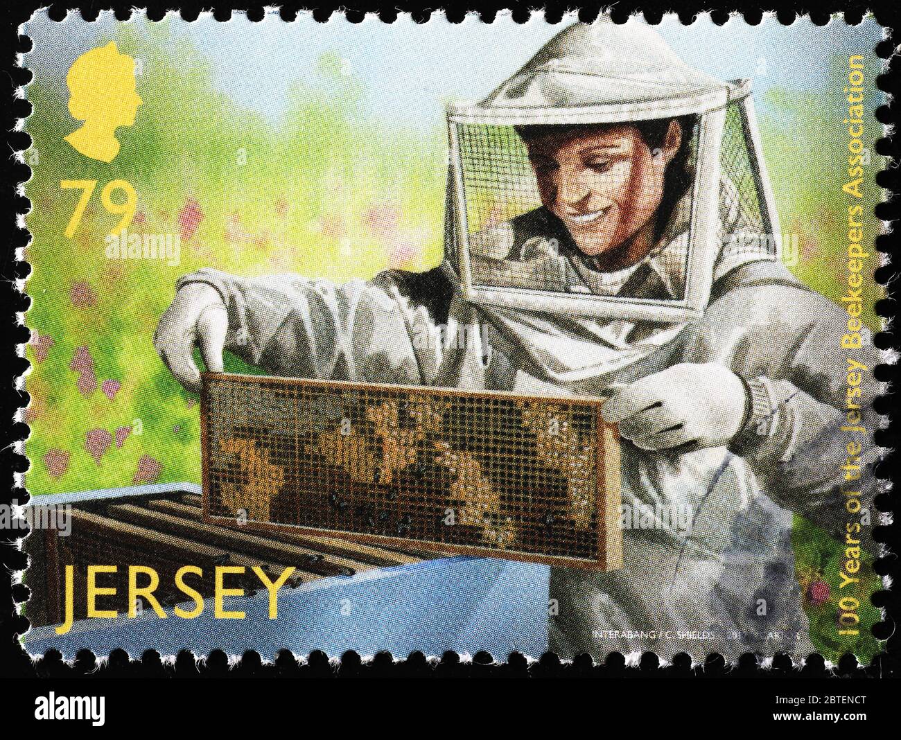 Beekeeper holding a brood frame on postage stamp Stock Photo - Alamy