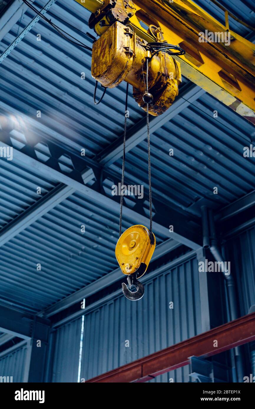 Industrial crane hook in a modern factory building Stock Photo - Alamy
