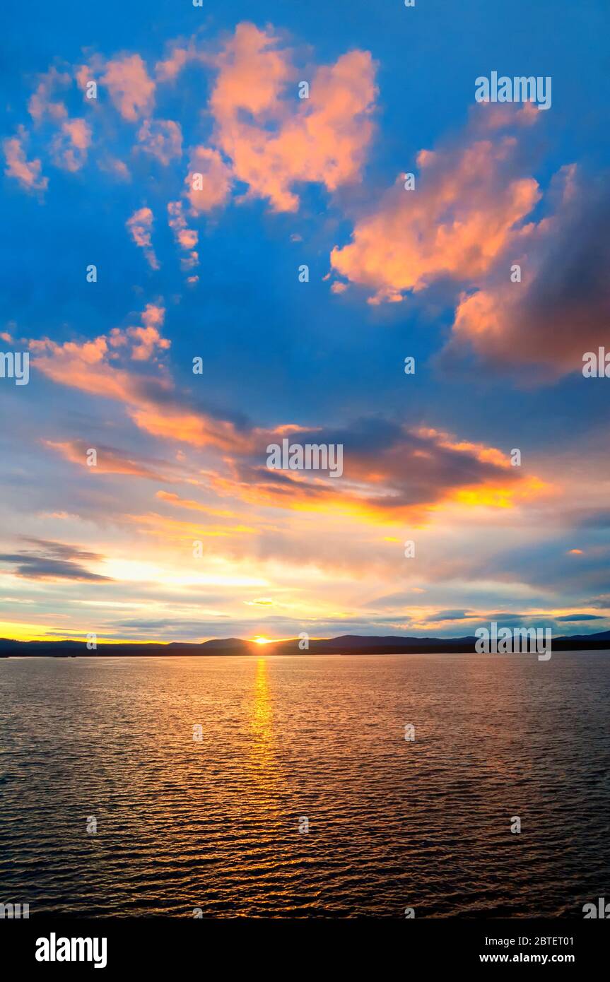 Ocean sunset landscape. Ocean water surface lit by sunset light. Summer ...