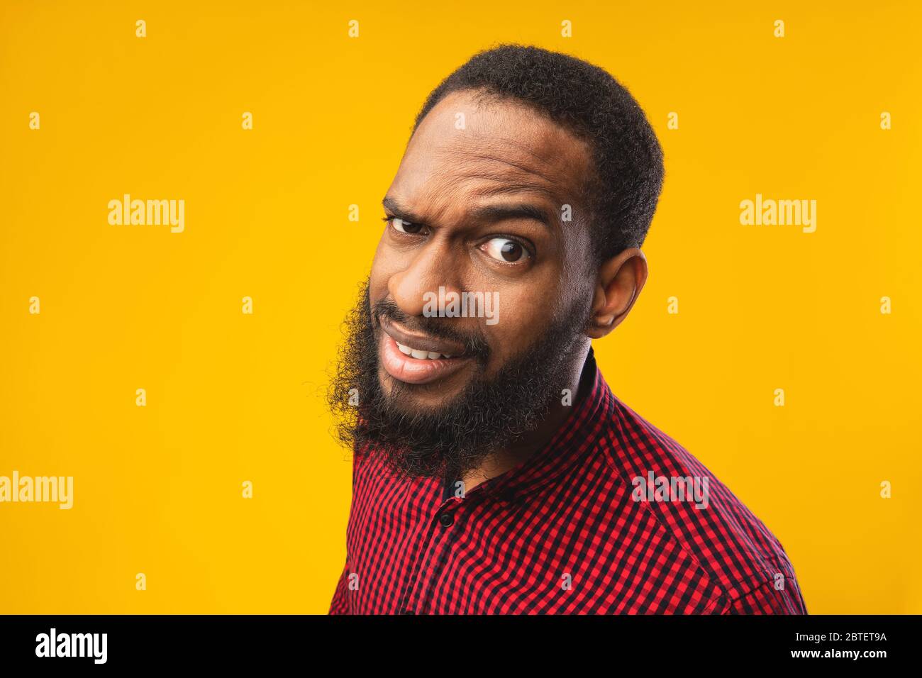 Confused african american man looking at camera Stock Photo - Alamy