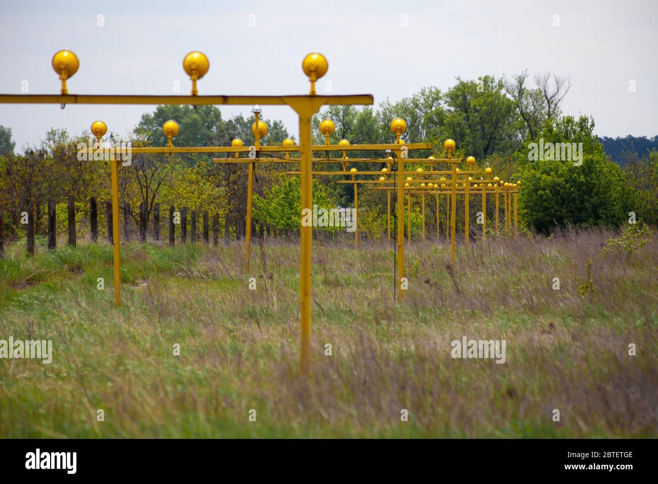 Take-off and landing lights of the aerodrome. Yellow beams and beams ...