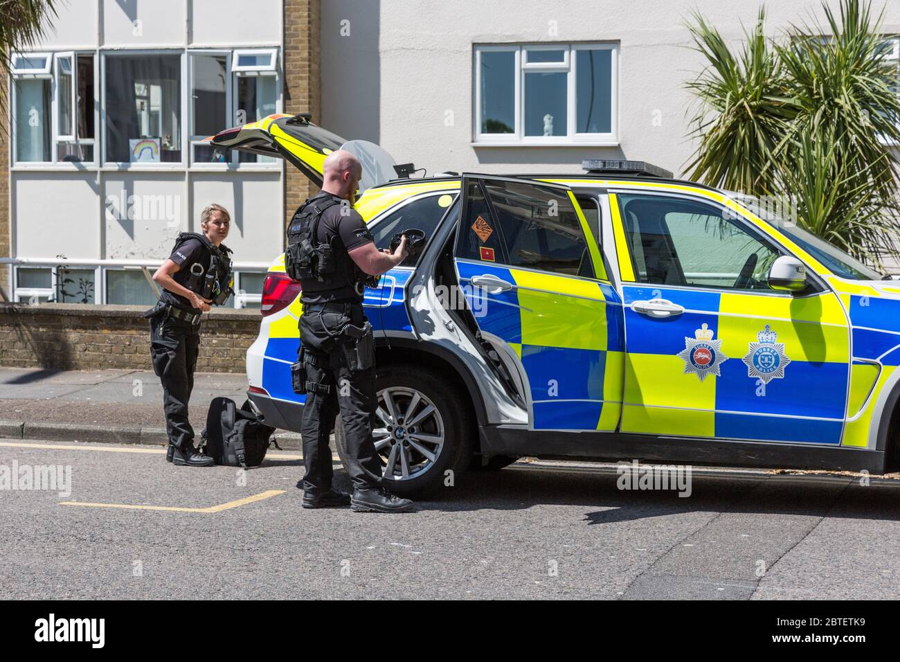 Eastbourne, England. 25 May 2020. Armed police in Compton Street ...