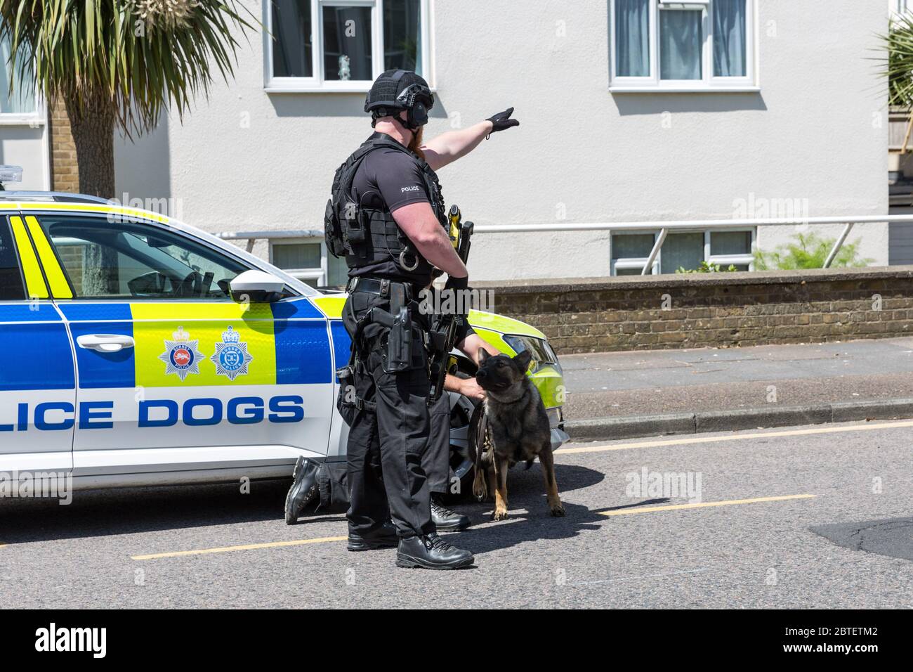 Eastbourne, England. 25 May 2020. Armed police in Compton Street ...