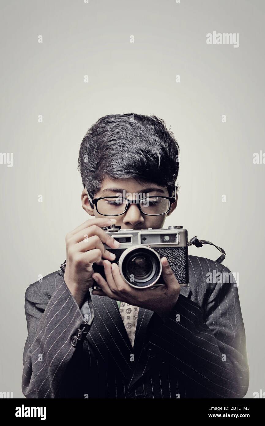 Beautiful child (kid, boy) wearing classes - photographer holding a ...