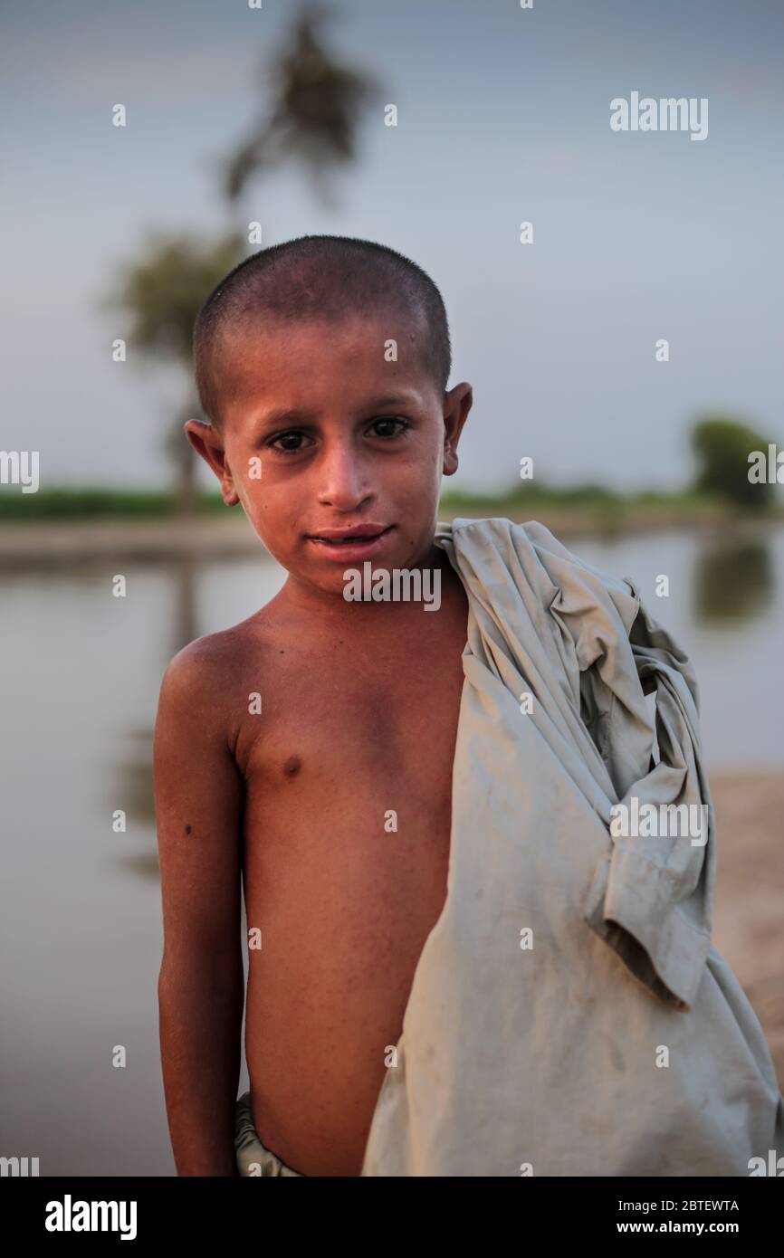 Portrait Of A Nacked Village Boy, Smiling And Looking At Camera In ...