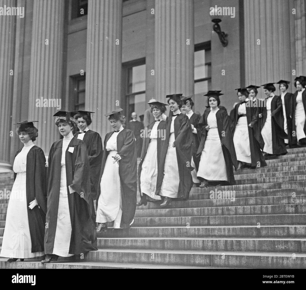 Female students walking down steps in caps and gowns - Barnard College ...