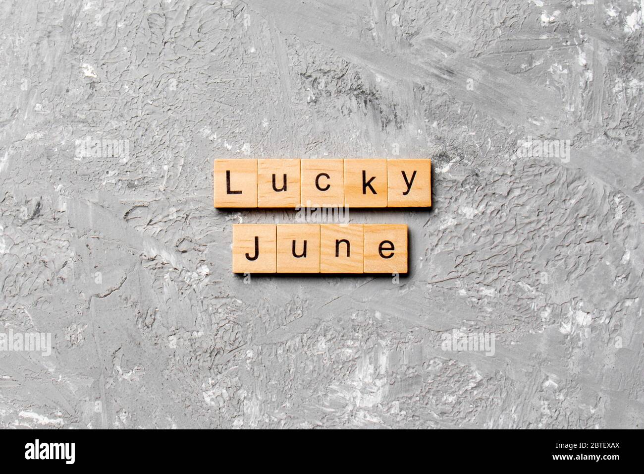 lucky June word written on wood block. Happy June text on table ...