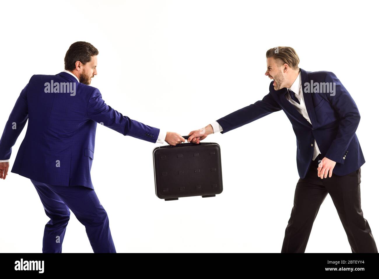 Partners with aggressive faces hold case on white background ...