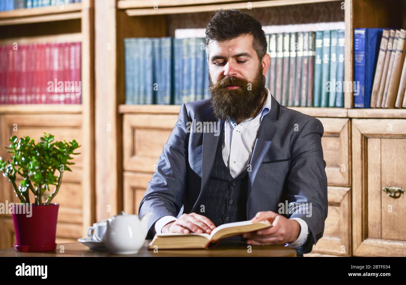 Aristocrat on thoughtful face reading book. Aristocratic lifestyle ...