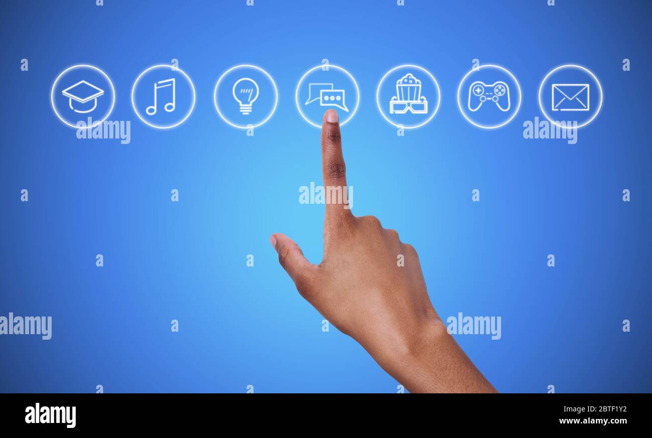 Closeup of African American guy picking among functional icons of ...