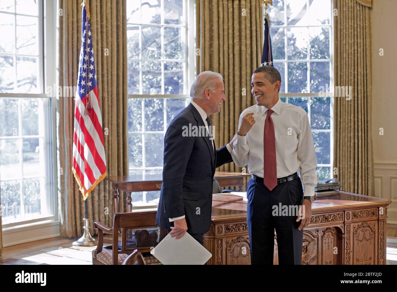 President Barack Obama and Vice President Joe Biden laugh together in ...