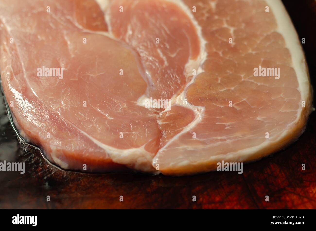 Smoked gammon steak formed from selected cuts of cured pork leg ...