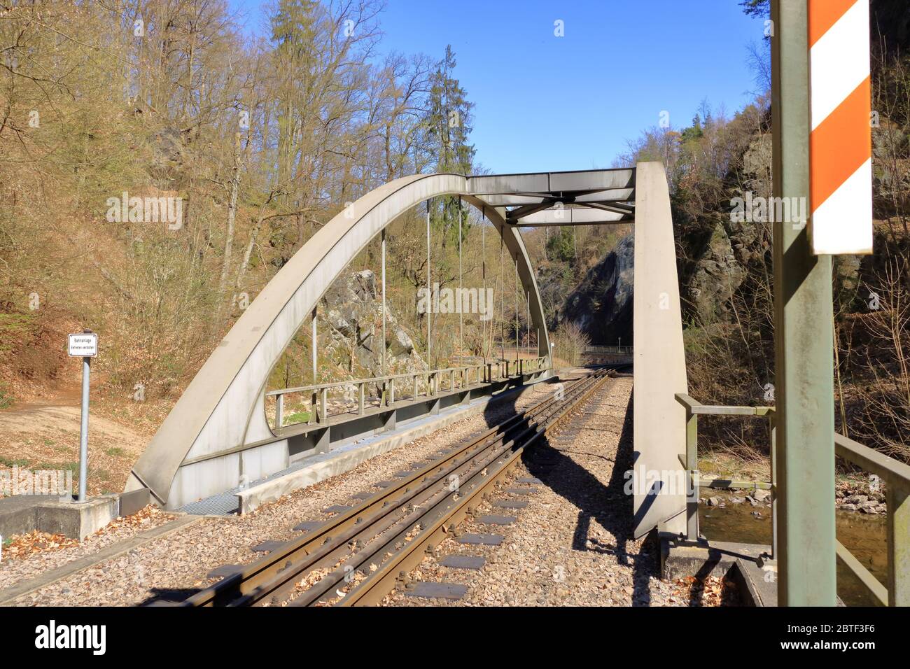 A Small old rusty steel train trestle bridge Stock Photo - Alamy