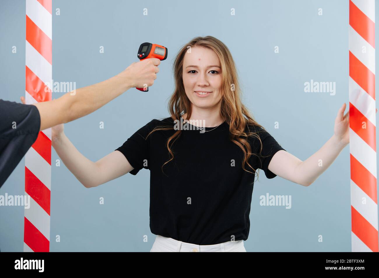staff are checking the temperature at control point Stock Photo - Alamy