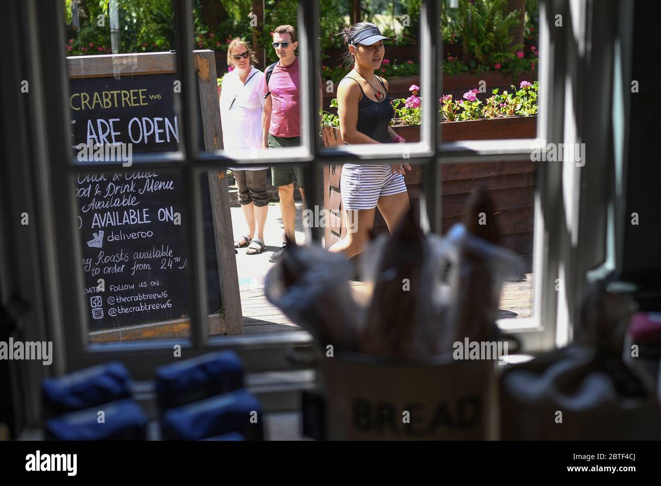 Customers queue at the crabtree pub in fulham hi-res stock photography ...