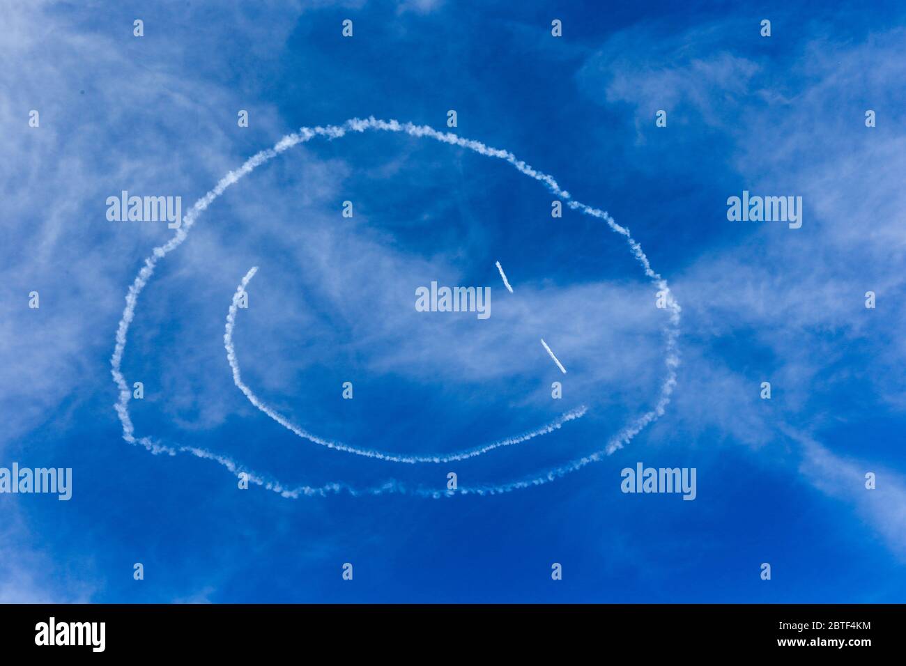 Skywriting smiley face in the sky Stock Photo - Alamy