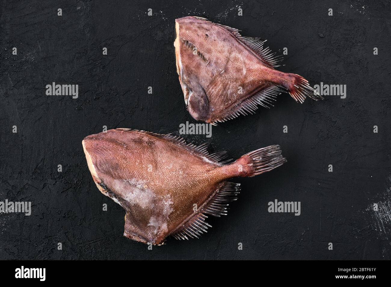 Raw crimson sea bream on black background Stock Photo - Alamy