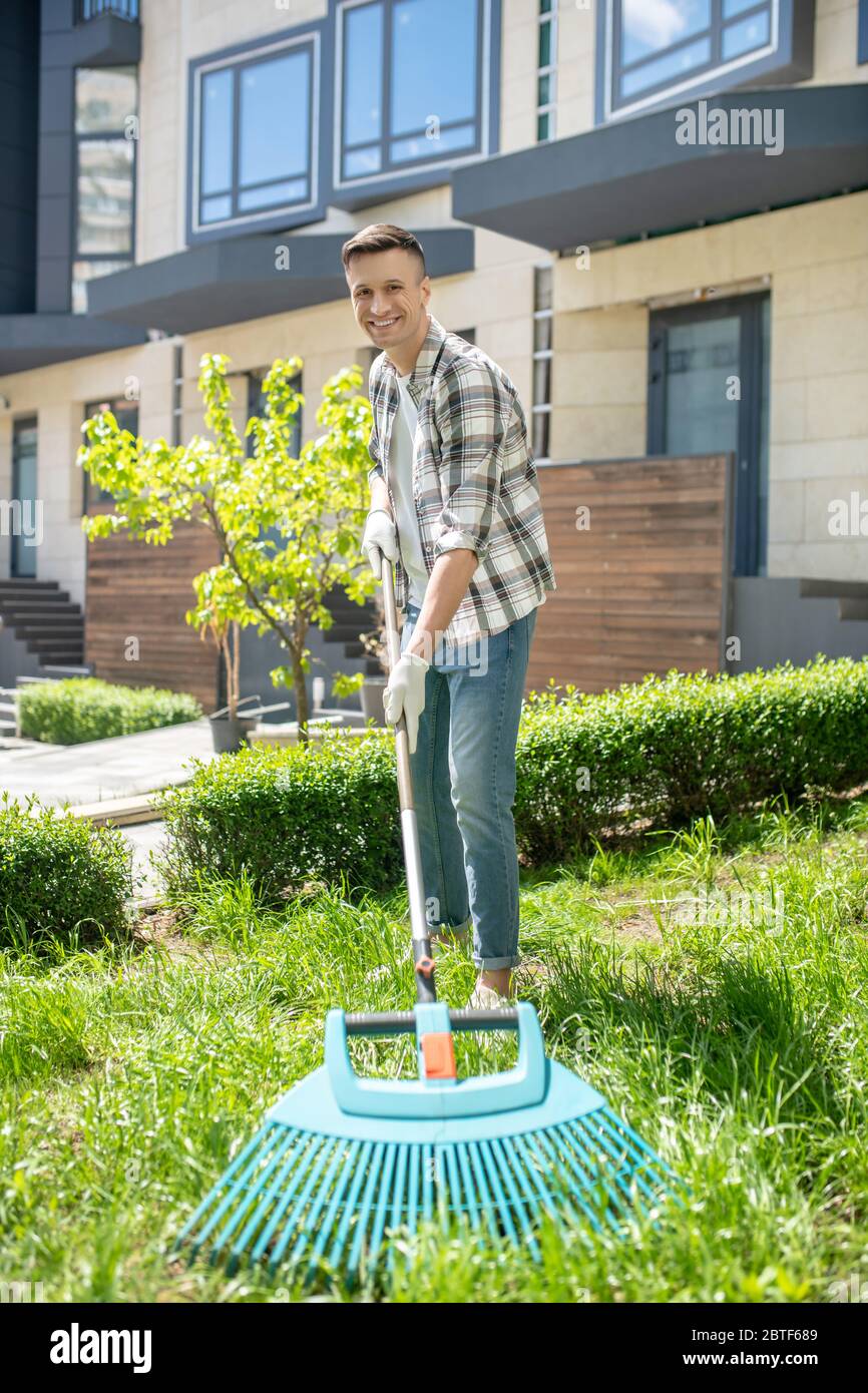 Male Raking Grass High Resolution Stock Photography and Images - Alamy