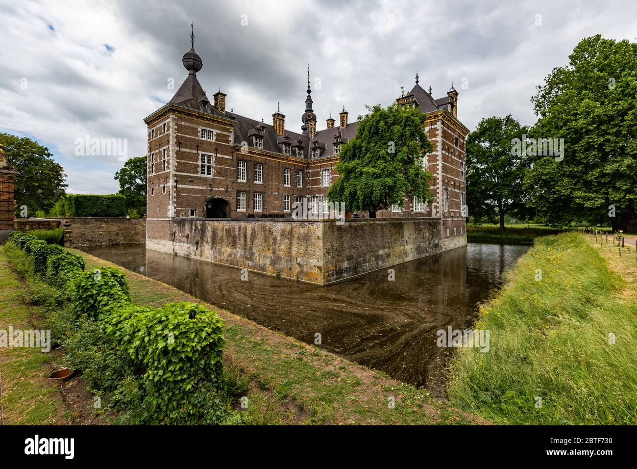 17th Century Eijsden Castle a moated manor house with a public park ...