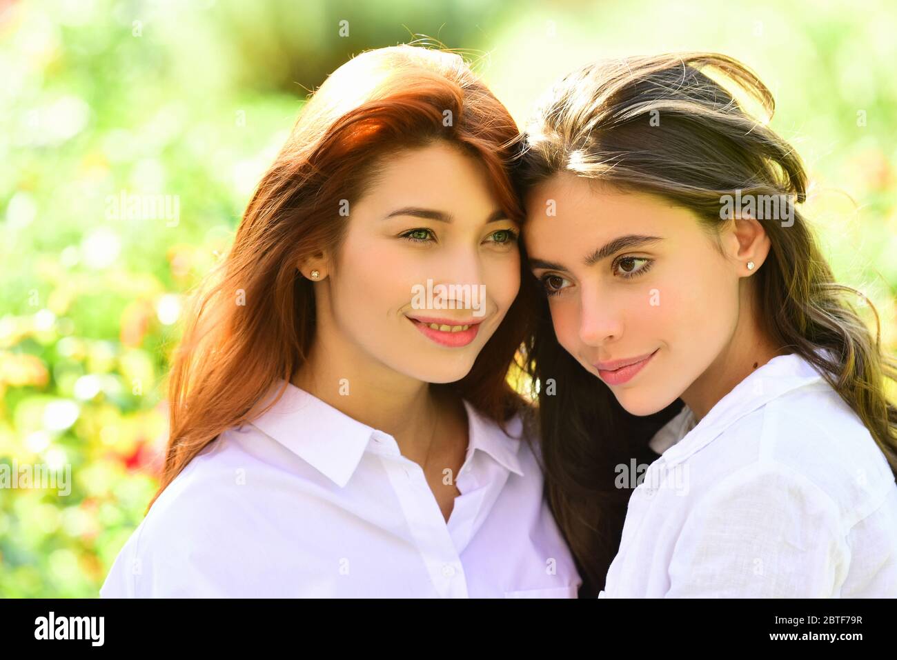 Close up lifestyle portrait of two pretty best friends girls, having ...
