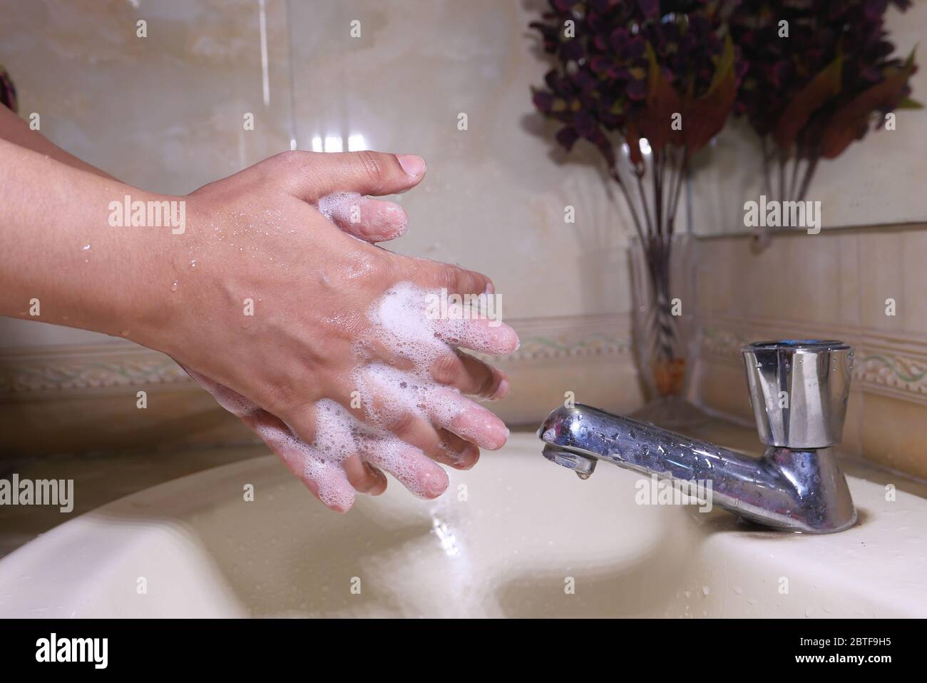 hands with soap warm water using hand sanitizer gel Stock Photo - Alamy