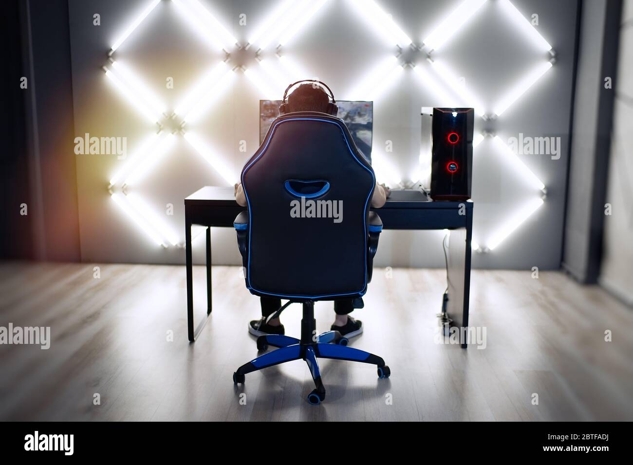 Professional gamer playing online video game at night time Stock Photo ...