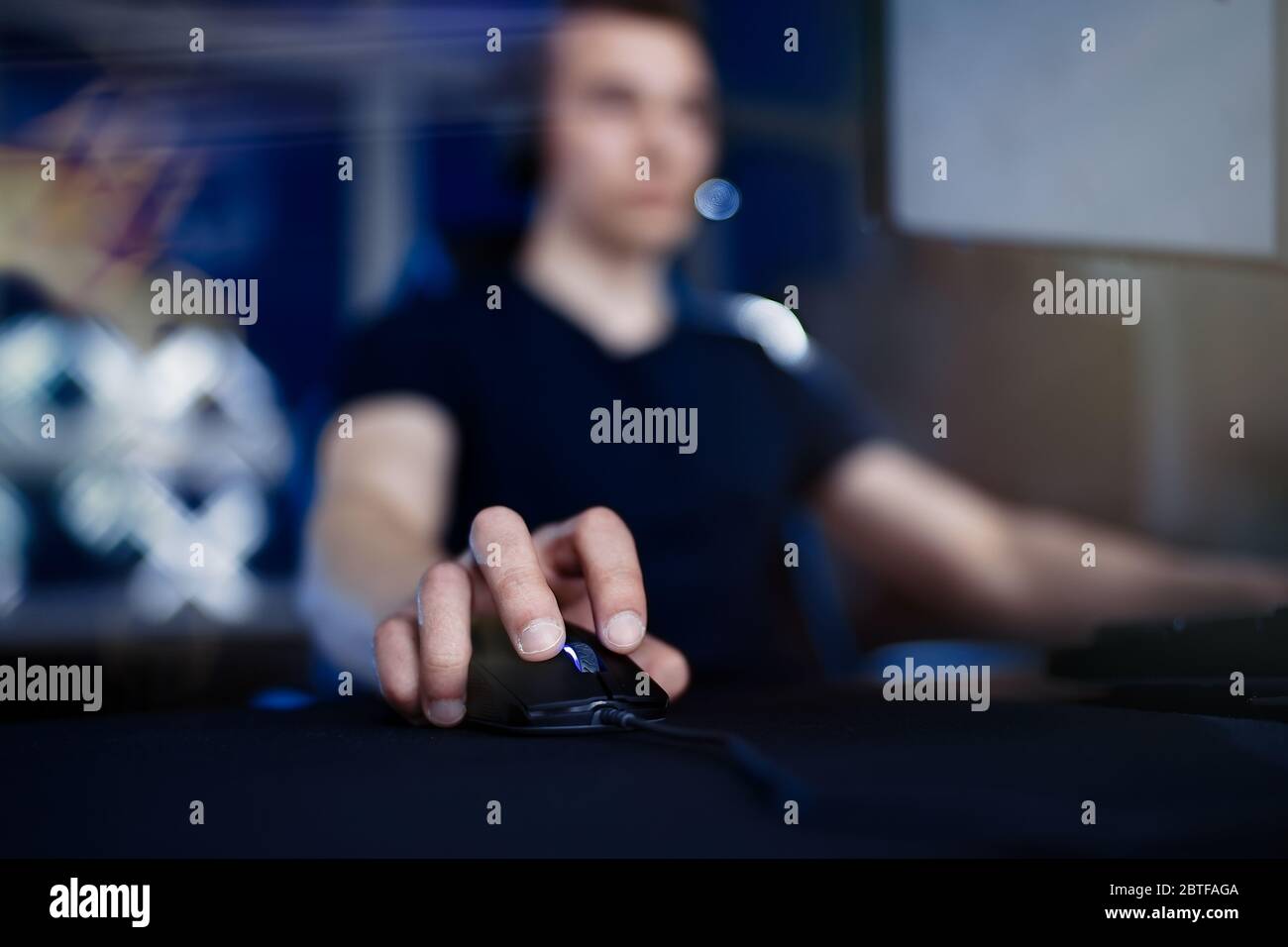 Professional gamer playing in evening hi-res stock photography and ...