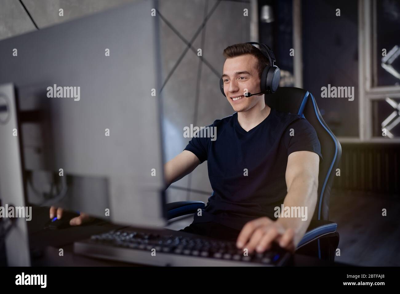 Professional gamer playing online video game at night time Stock Photo ...