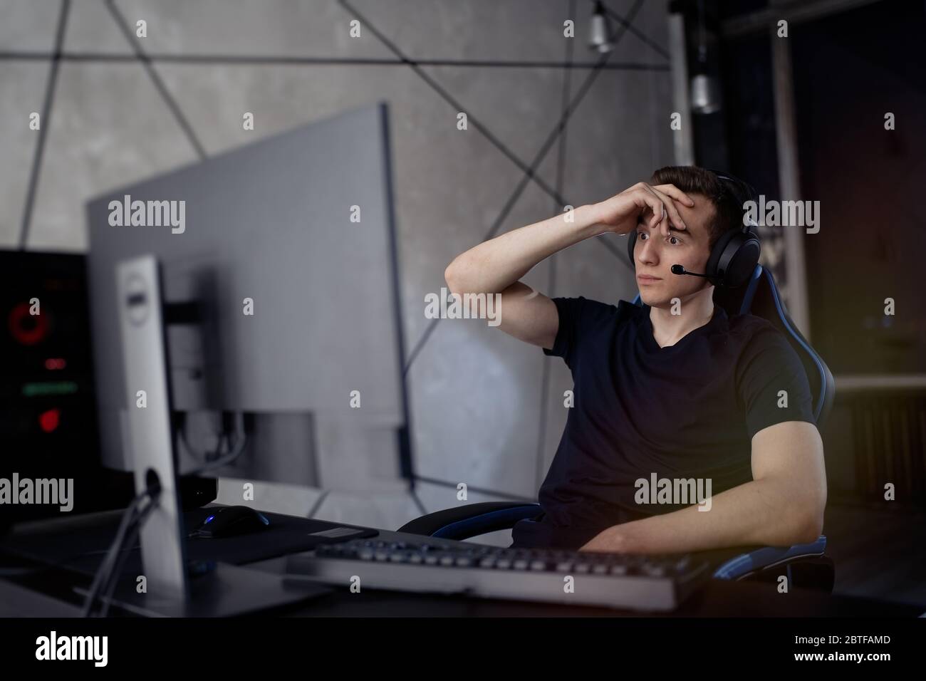 Young upset gamer playing online video games on computer and feel ...