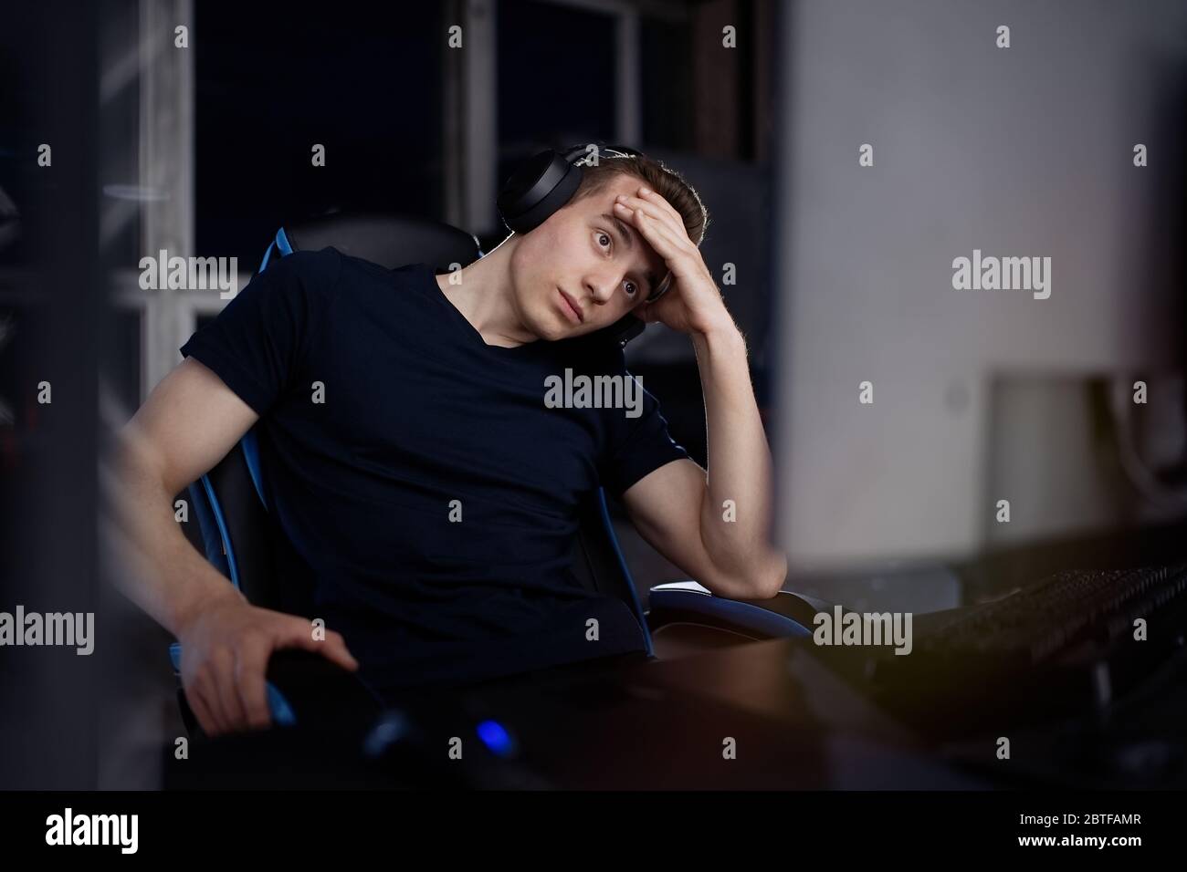 Young upset gamer playing online video games on computer and feel ...