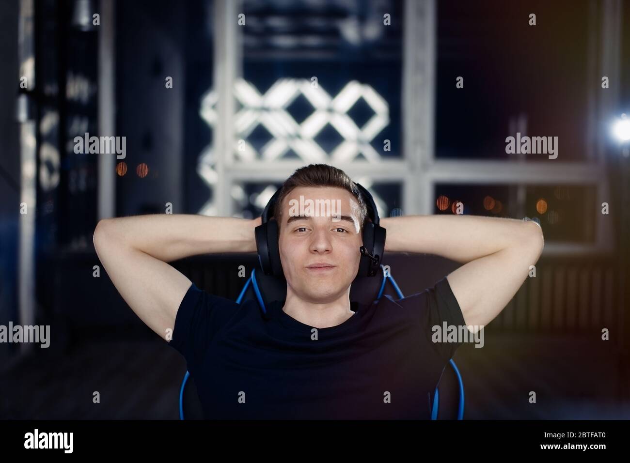 Young gamer playing online video games on computer and satisfied after ...