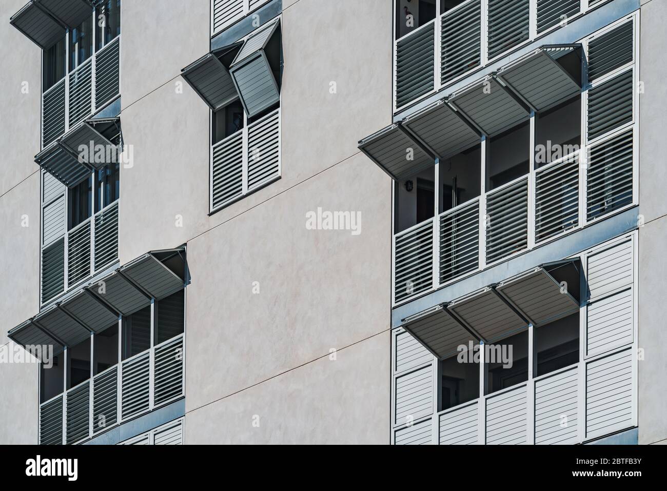 Metallic folding shutters of the facade of a modern residential ...