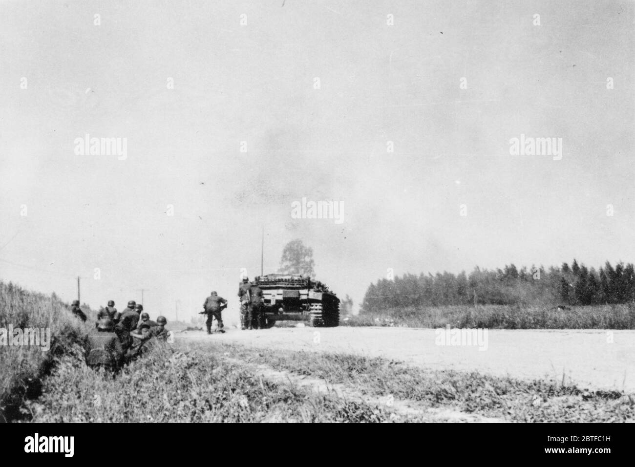A Reconnaissanve Unit advances under the protection of a tank Operation ...