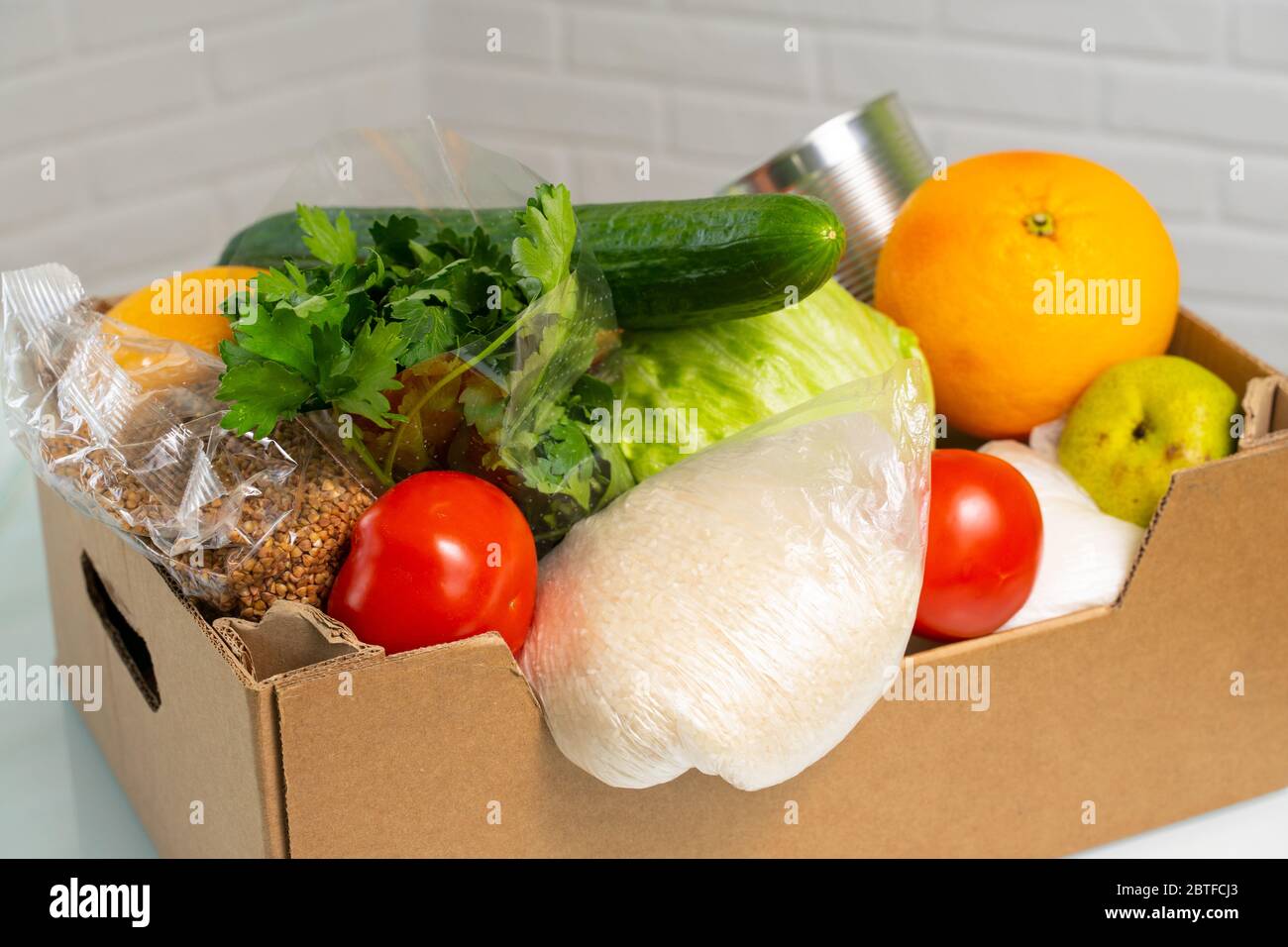 food in a cardboard box. donations for the poor Stock Photo - Alamy