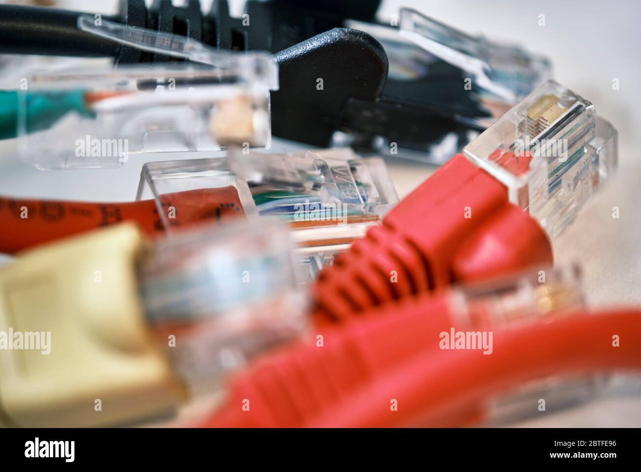 Close-up image of a variety of colourful networking cables and ...