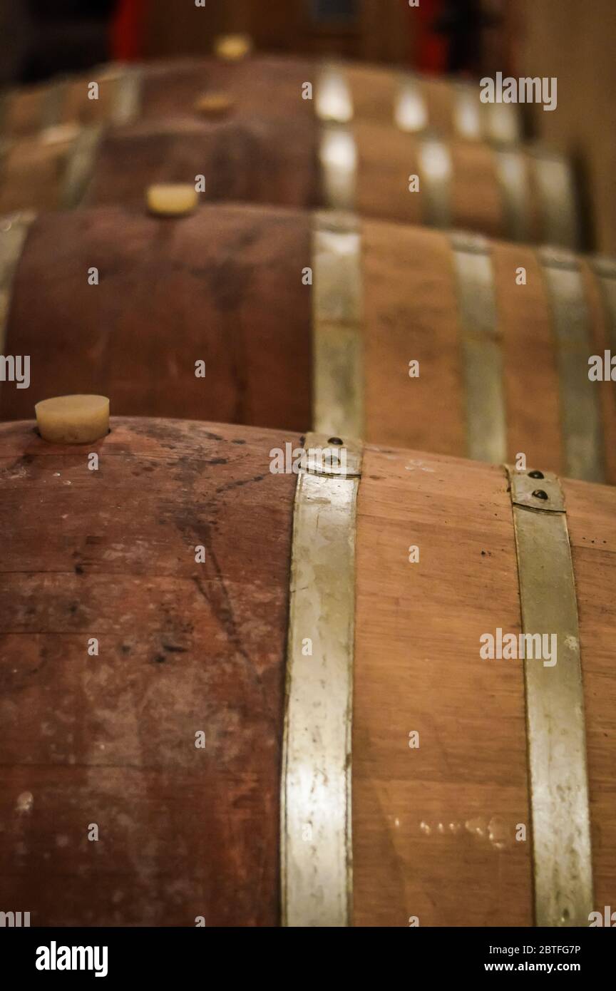 Rows of Wine Barrels Stacked in Winery Cellar Closeup Stock Photo - Alamy