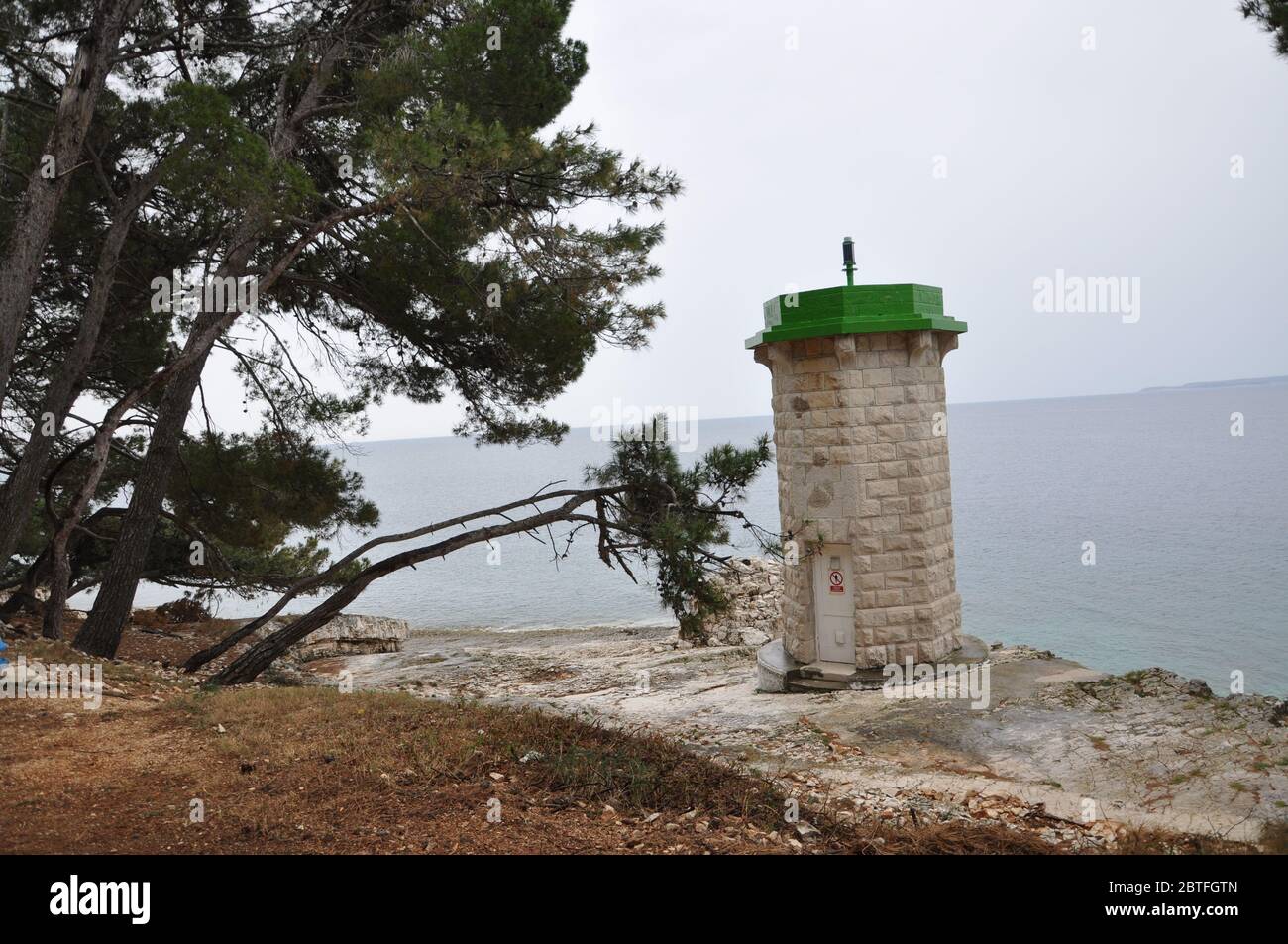 Small rocky island lighthouse hi-res stock photography and images - Alamy