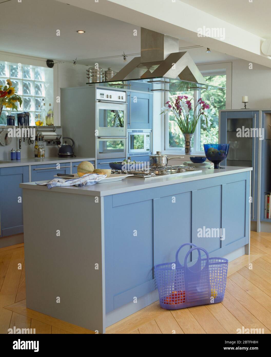 Steel extractor above hob in blue island unit in modern kitchen Stock ...